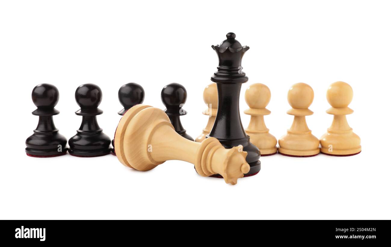 Black chess queen near fallen white one in front of pawns on white ...