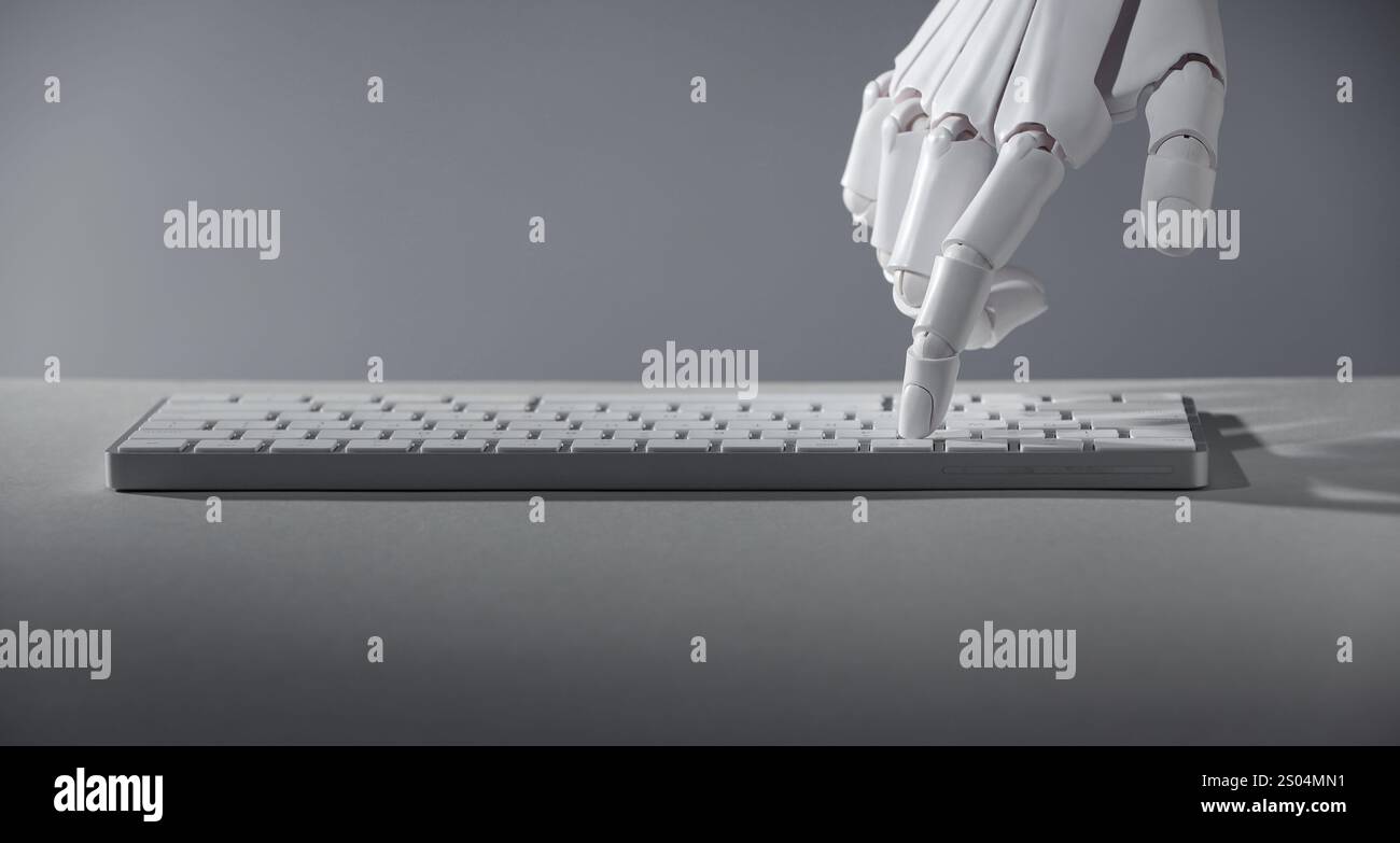 Artificial intelligence. Robot hand using keyboard on grey background ...