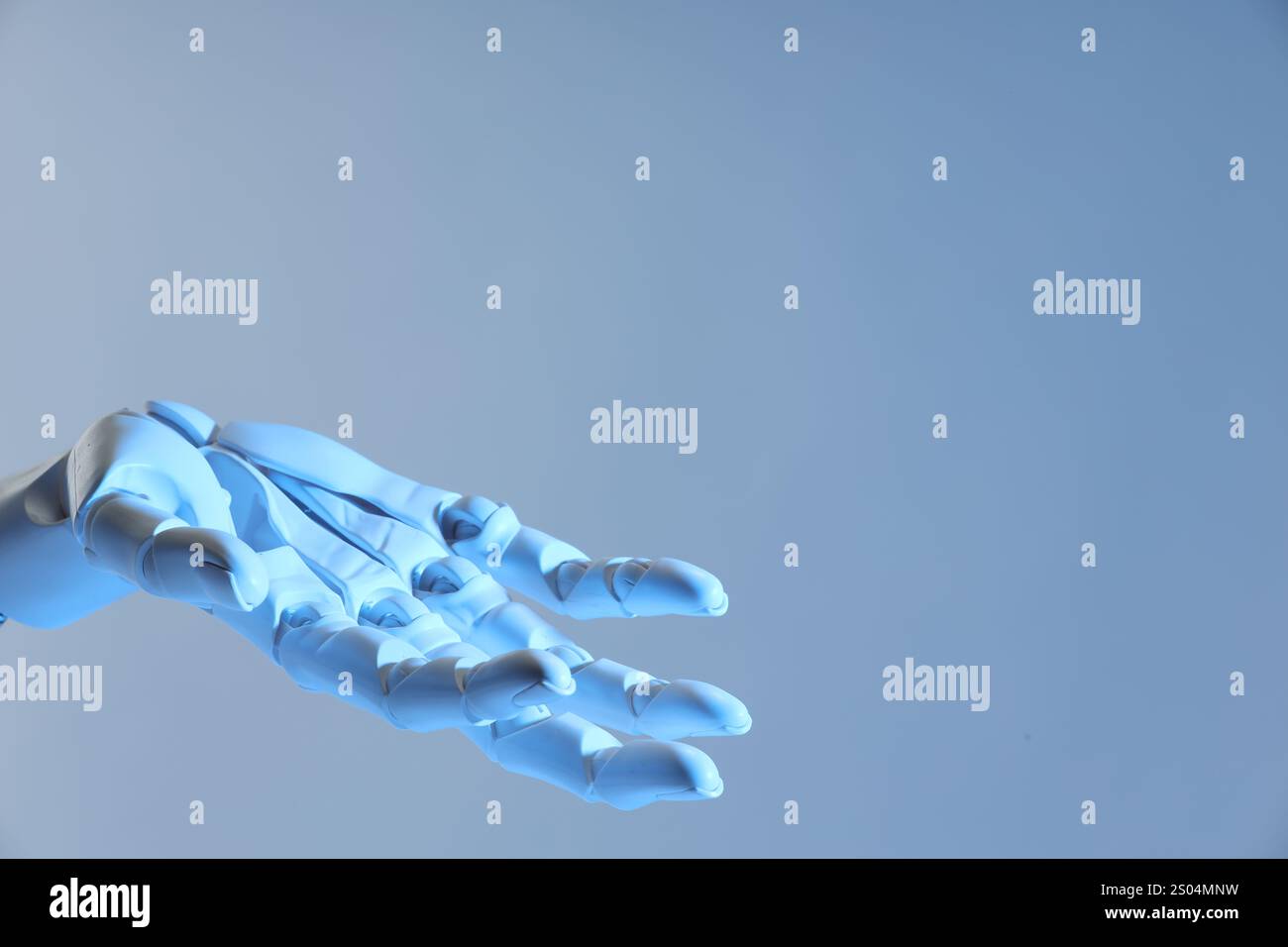Artificial intelligence. Robot hand gesturing on pale light blue ...