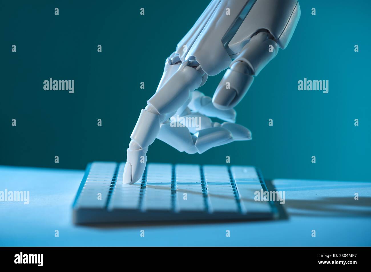 Artificial intelligence. Robot hand using keyboard at table in blue ...