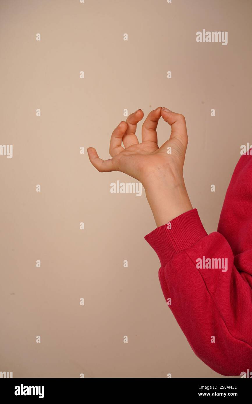 Clean, minimalist background enhances focus on the gesture. Human hand ...