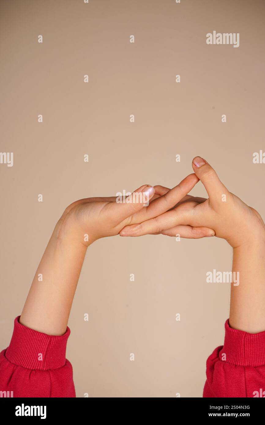 Clasped hands in the foreground create a symbolic representation of ...