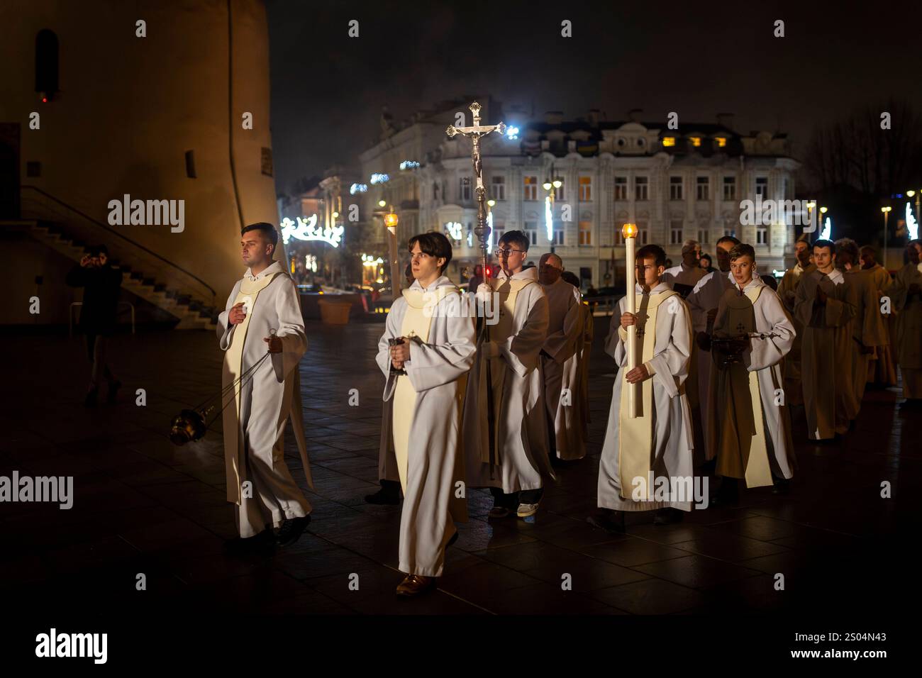 Priests and clergy walk in a procession to attend the Christmas ...