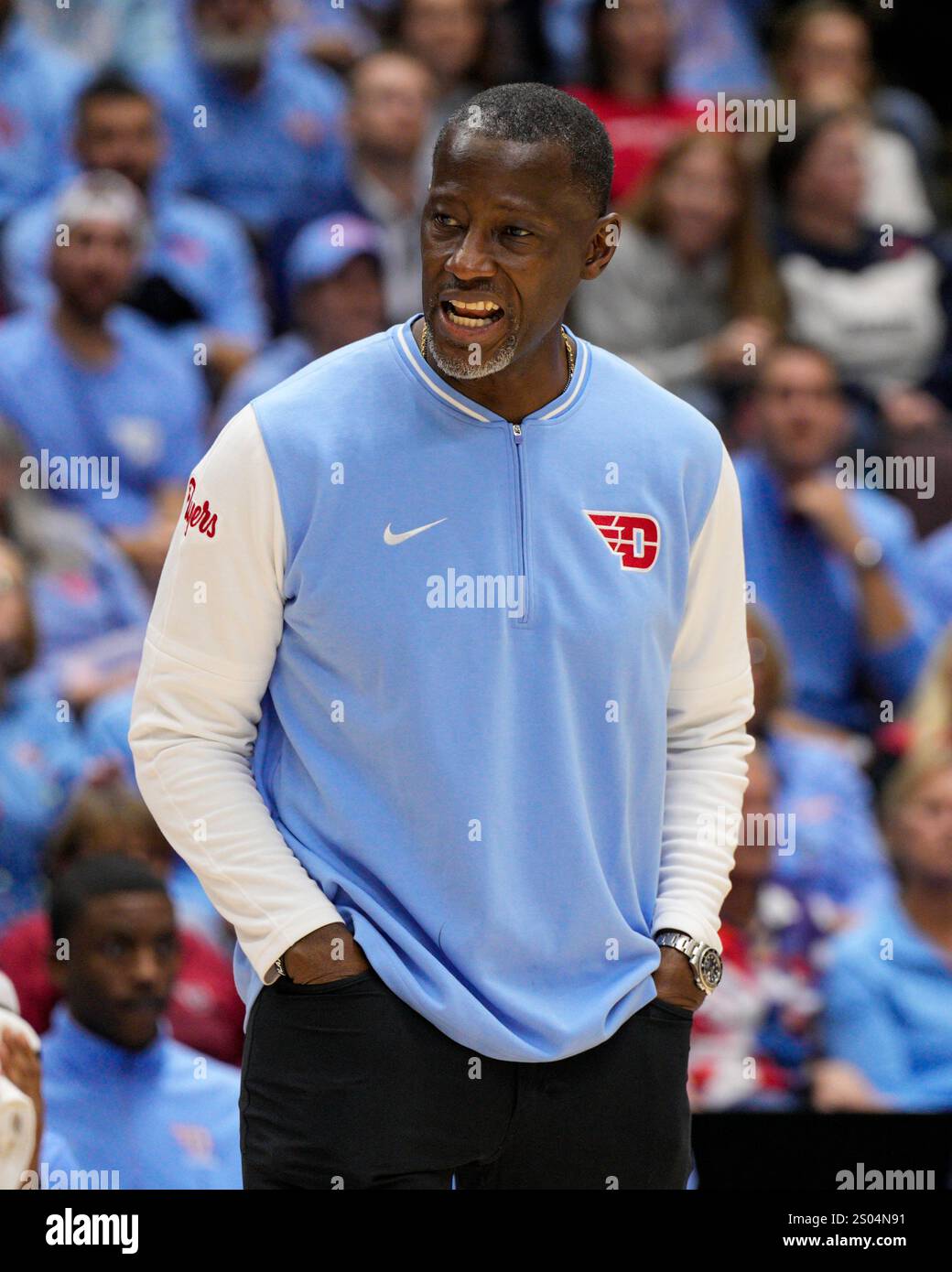 Dayton head coach Anthony Grant, right, speaks with an official during ...