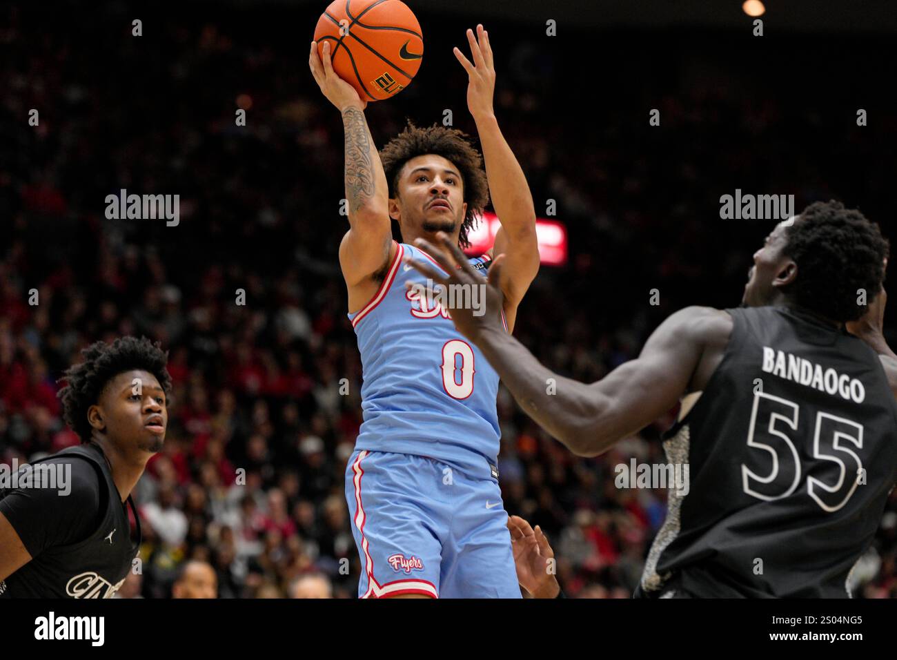 Dayton guard Javon Bennett (0) shoots against Cincinnati forward Aziz ...