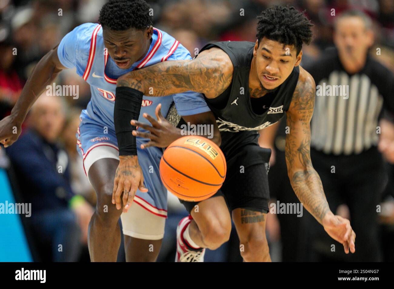 Cincinnati forward Dillon Mitchell (23) chases a loose ball against ...