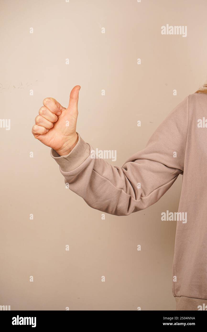 A raised thumb sends a clear message of encouragement and affirmation ...