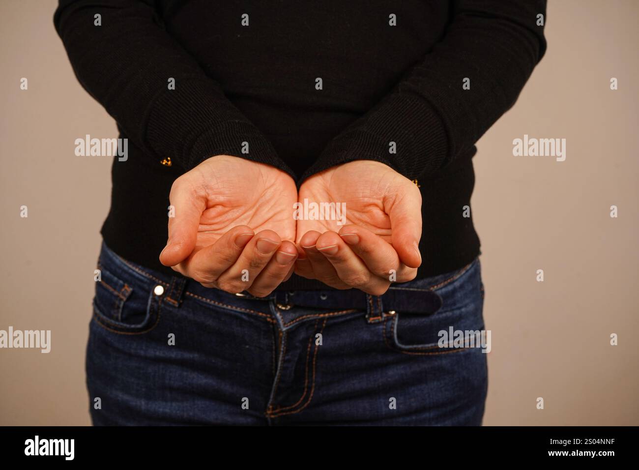 Two hands lie side by side, forming a symbol of peace and kindness. The ...