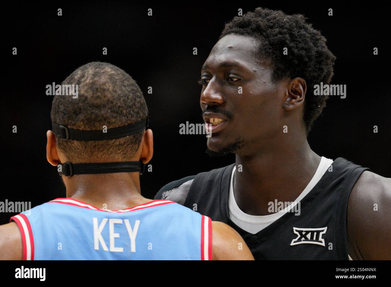 Cincinnati's Aziz Bandaogo, right, speaks with Dayton's Zed Key (23 ...