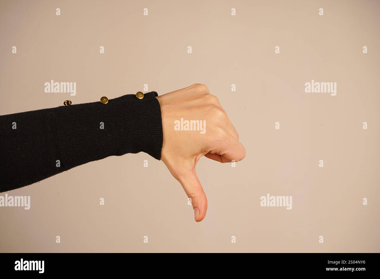 With the thumb pointed down, the hand conveys a strong sense of ...