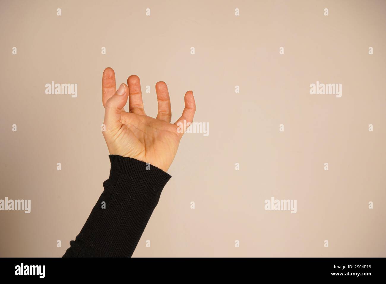 With fingers curved and spaced out, the hand replicates a cat's paw in ...