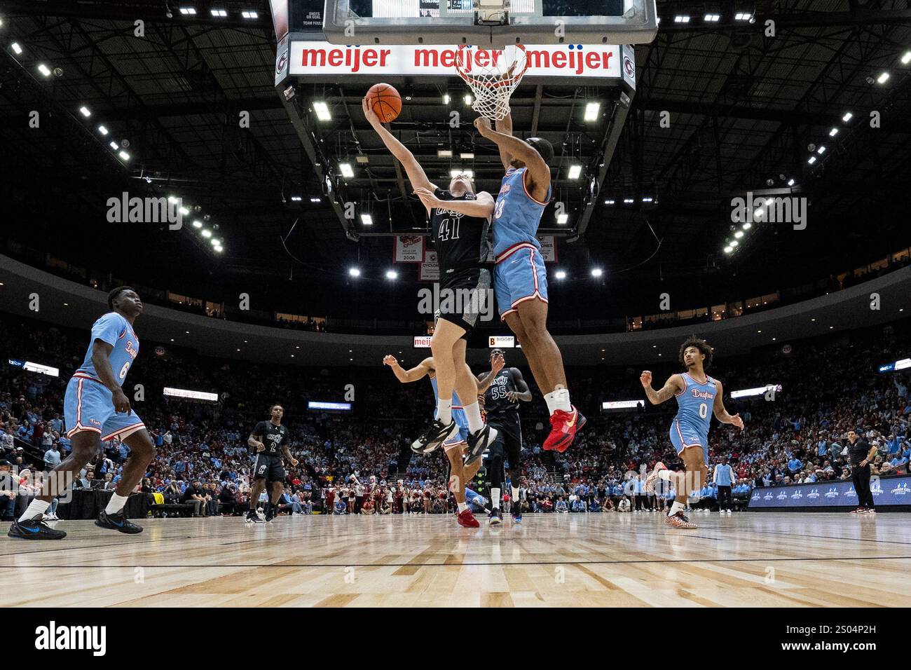 Cincinnati guard Simas Lukosius (41) shoots against Dayton forward Zed ...