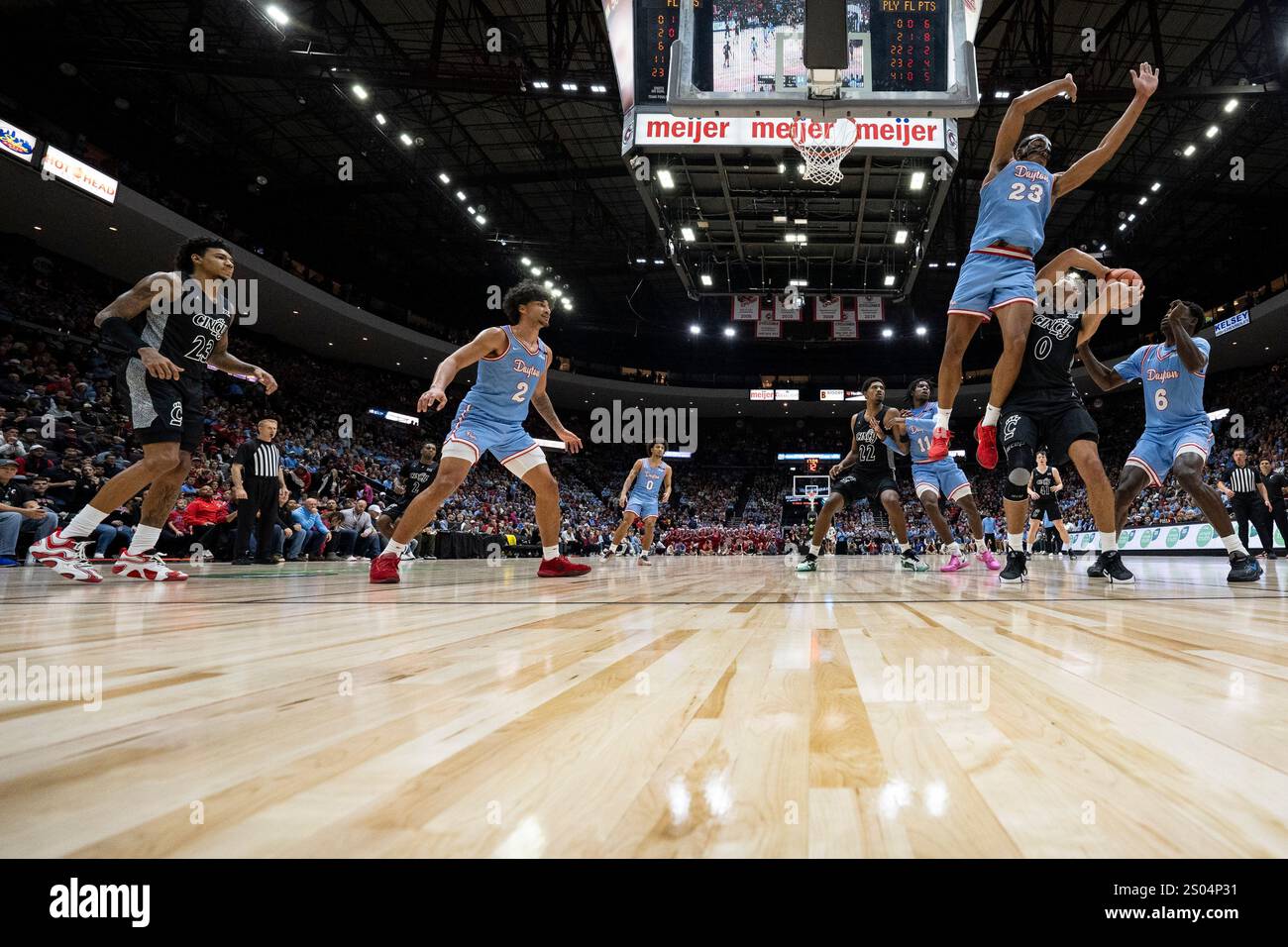 Dayton forward Zed Key (23) defends against Cincinnati guard Dan ...