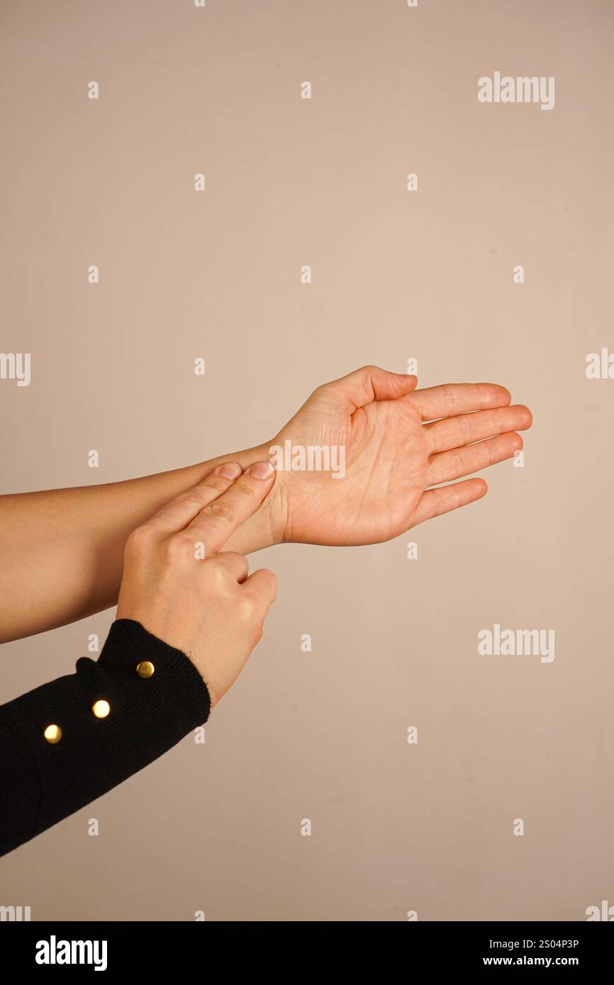 One hand grasps the wrist of the other in a gesture of union. This pose ...