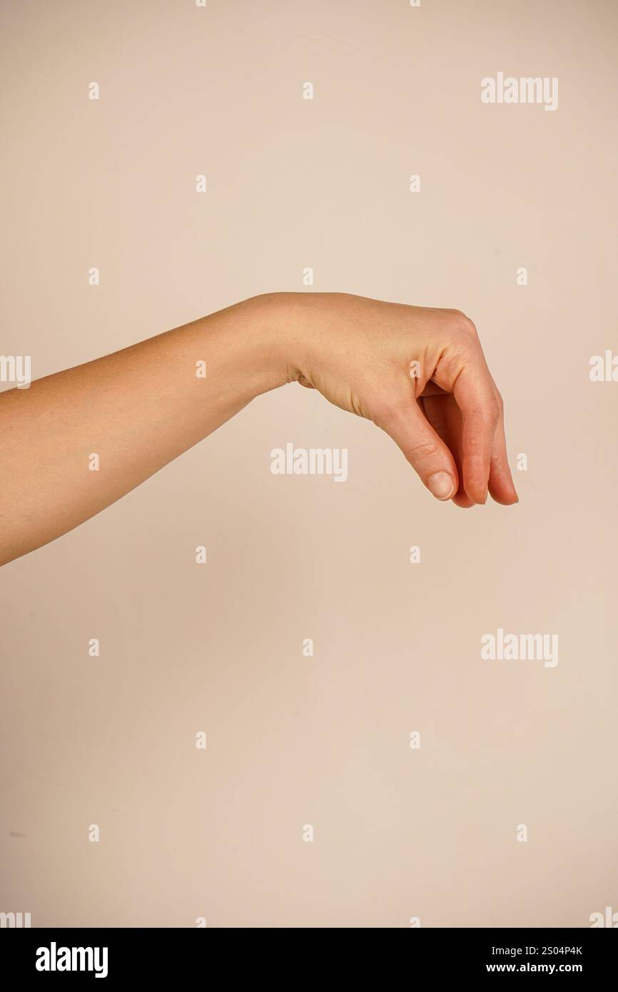 Fingers are pressed together against the thumb, forming a circular ...