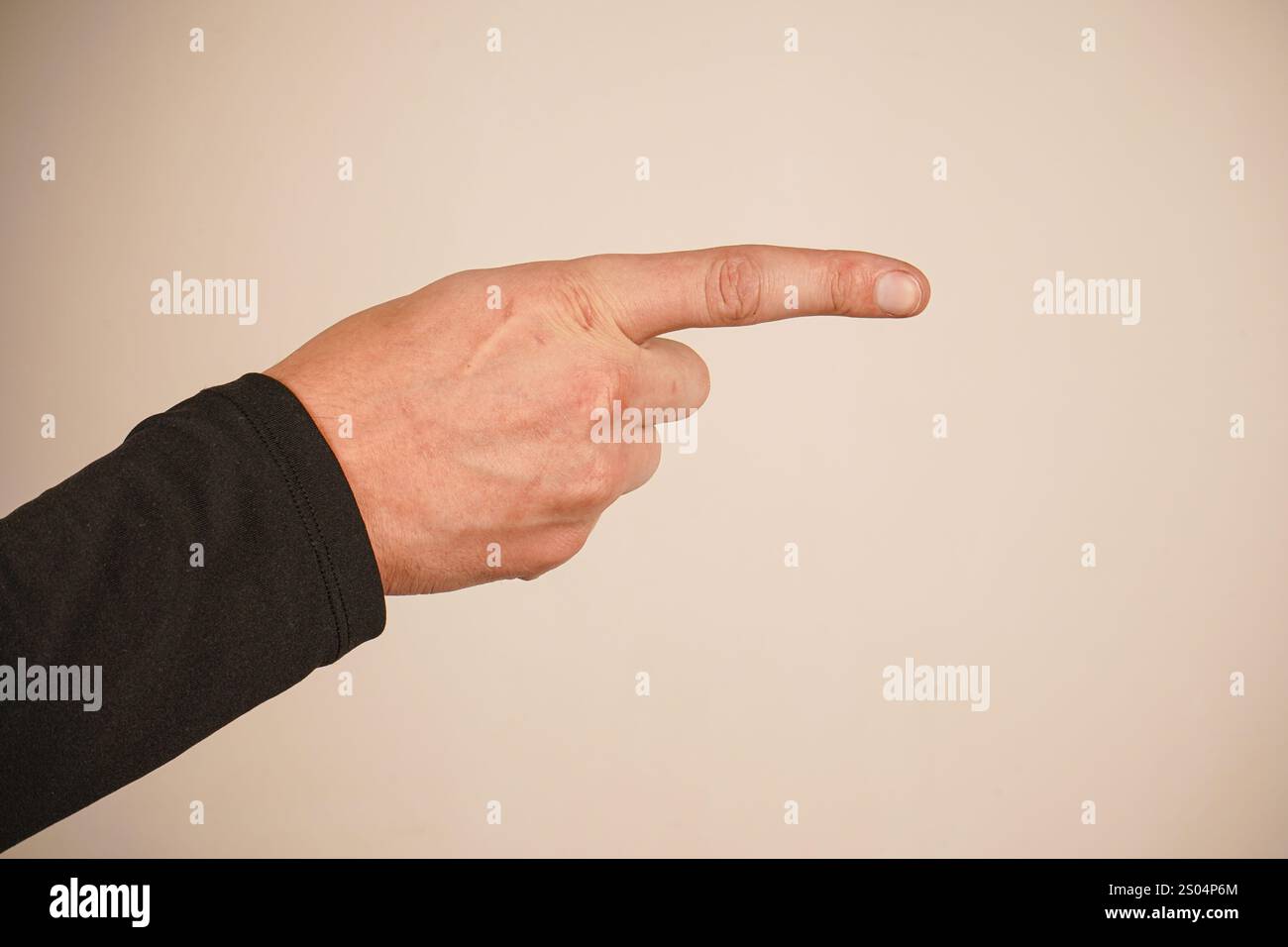 A hand with the index finger extended forward creates a gesture of ...