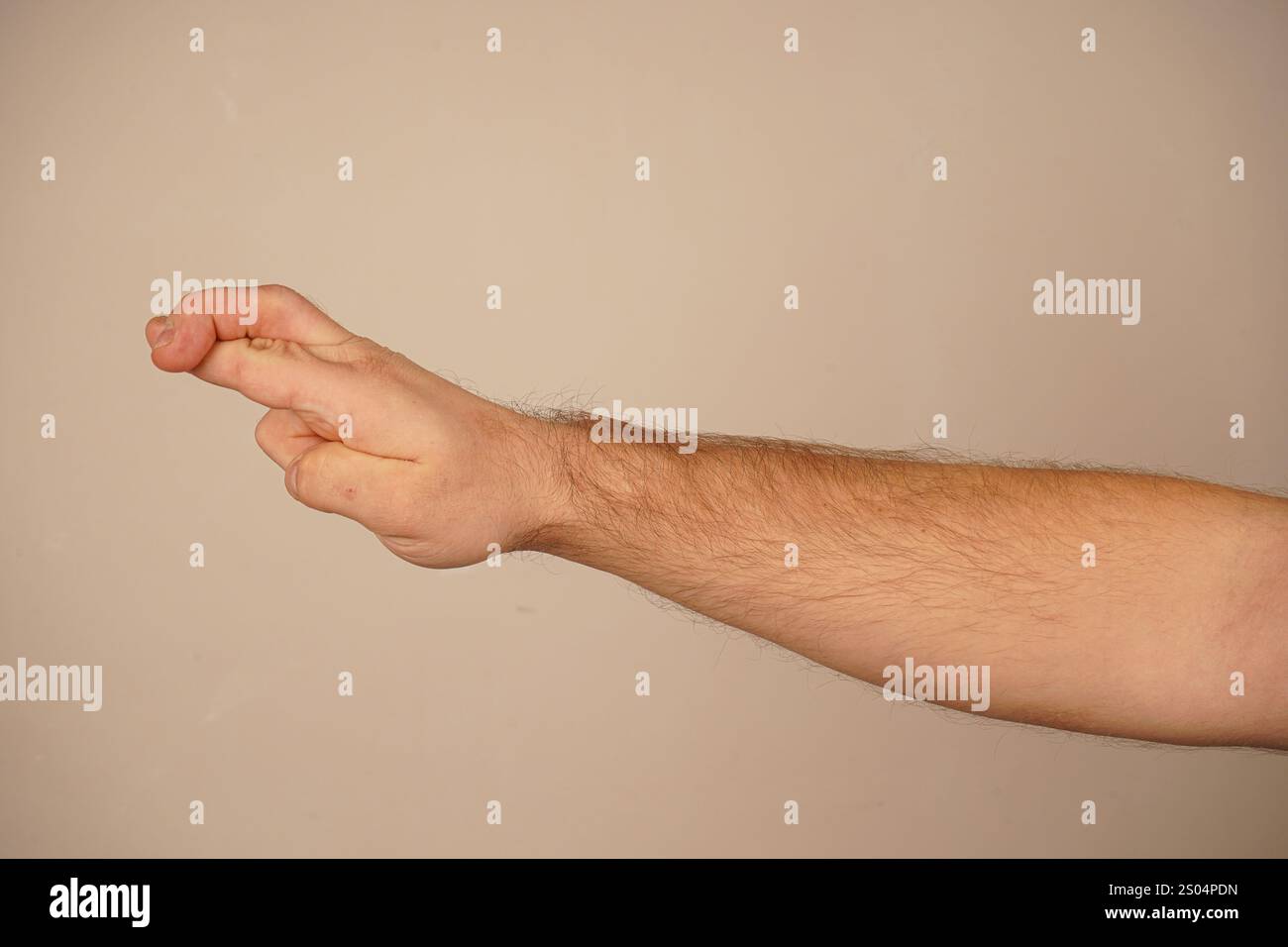 The index and middle fingers of the hand are crossed, a universal symbol of good luck. This ...