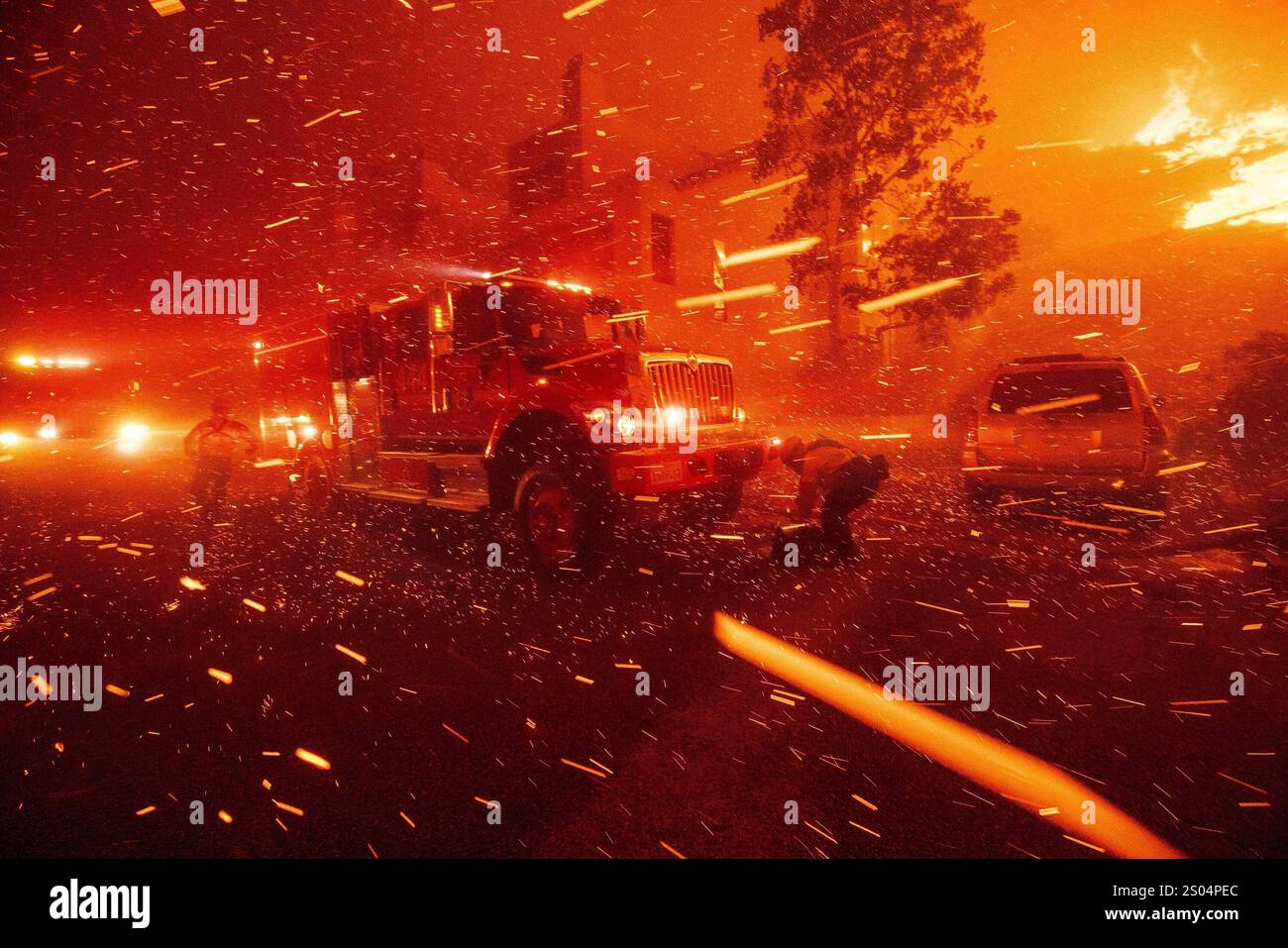 FILE - Firefighters battle the Franklin Fire in Malibu, Calif., Dec. 10 ...