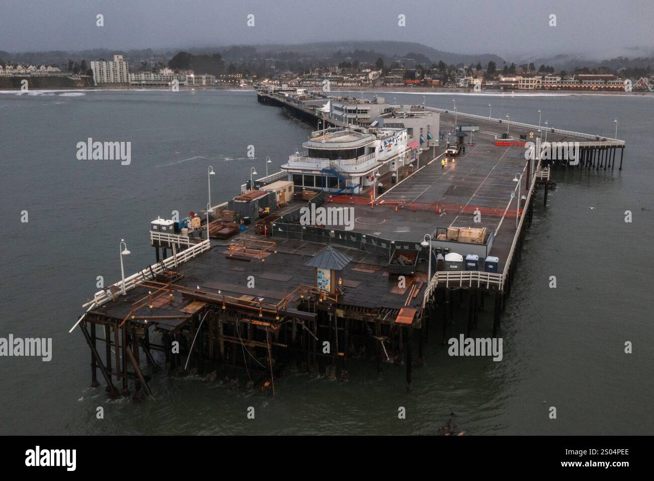 The damaged Santa Cruz Wharf is visible in Santa Cruz, Calif., Tuesday ...
