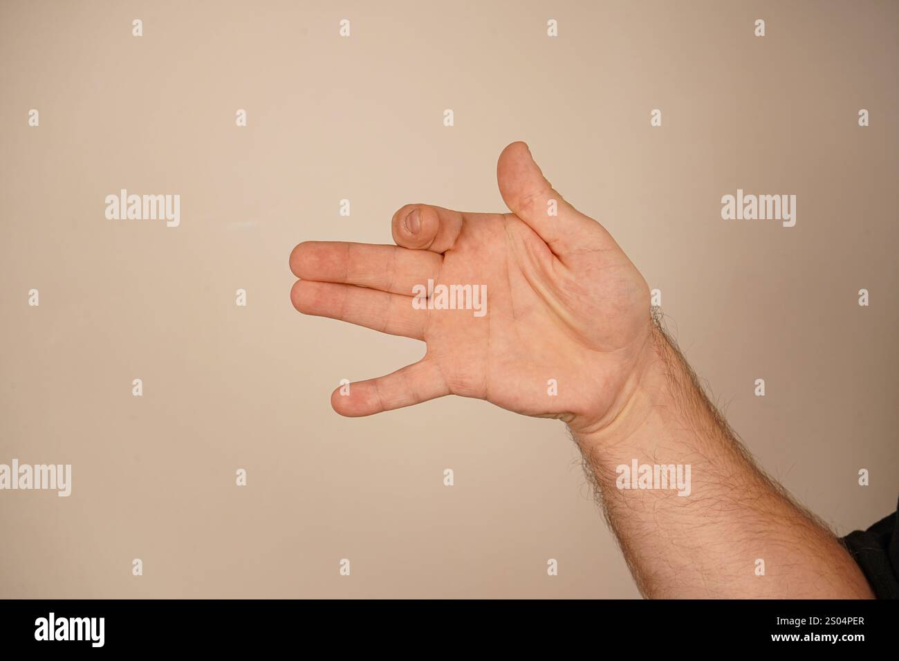 The hand gesture mimics the open mouth of a dog, combining whimsy and ...