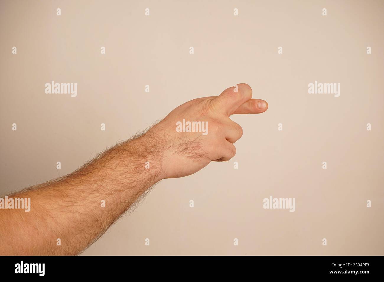 The index and middle fingers of the hand are crossed, a universal symbol of good luck. This ...