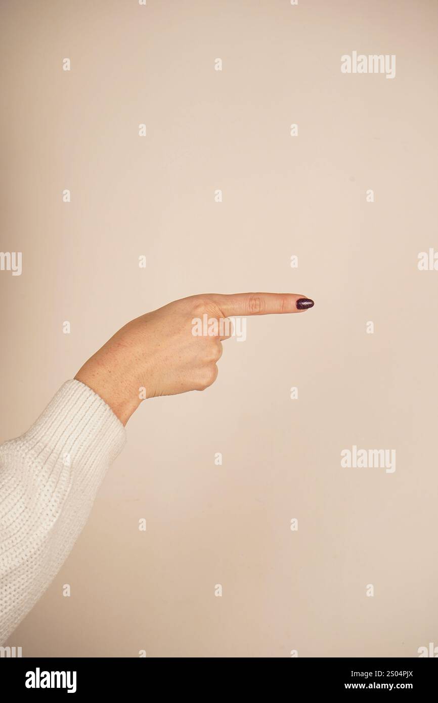 The index finger points forward with intent, drawing attention to ...