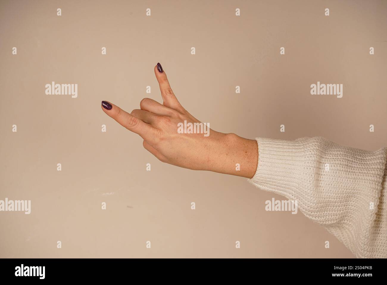 The "heavy metal" hand gesture is a bold expression of love for rock ...