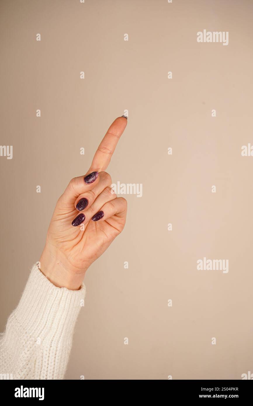 The index finger points forward with intent, drawing attention to ...