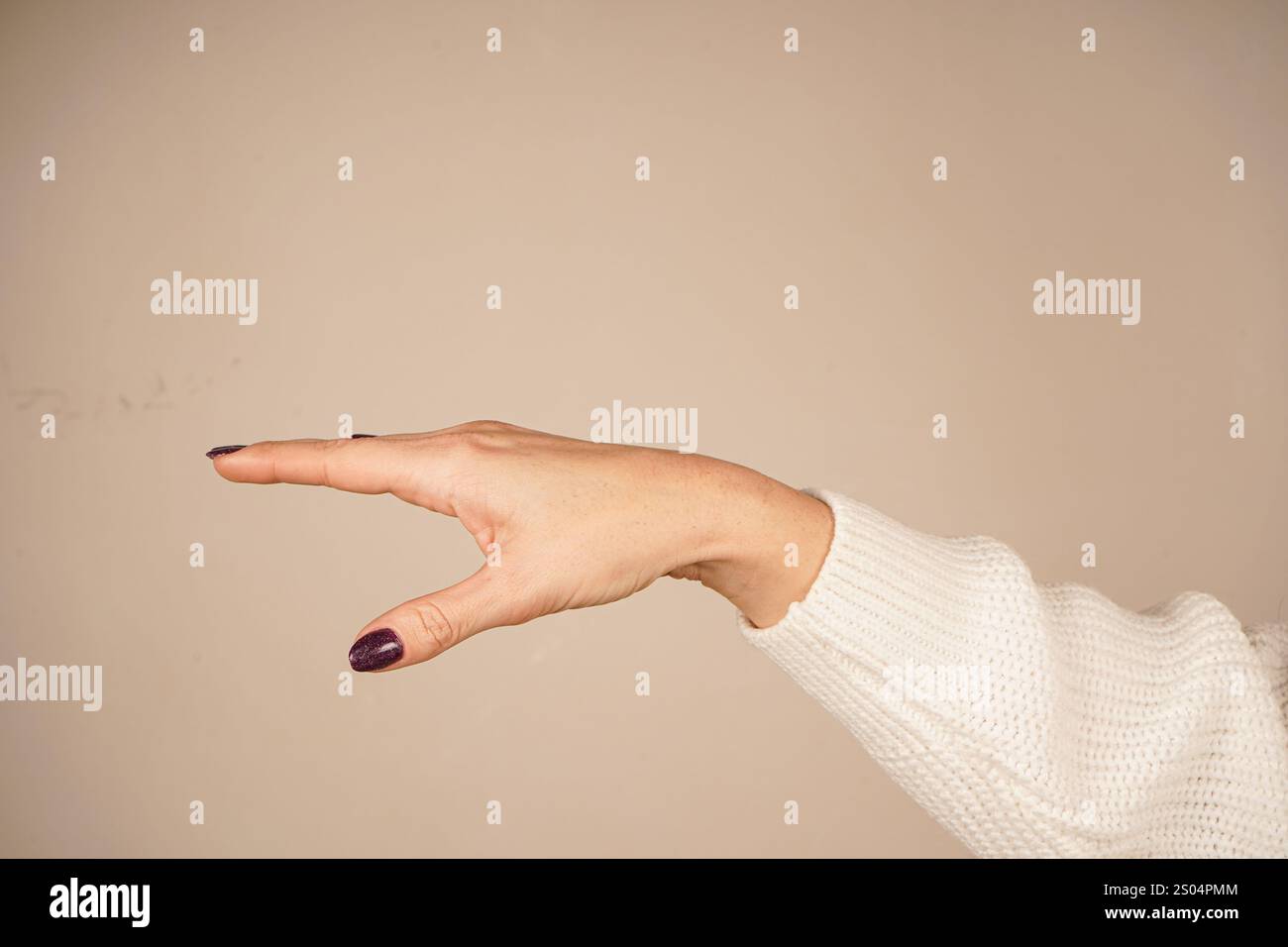 A single hand with an open palm faces upward, creating a gesture of ...