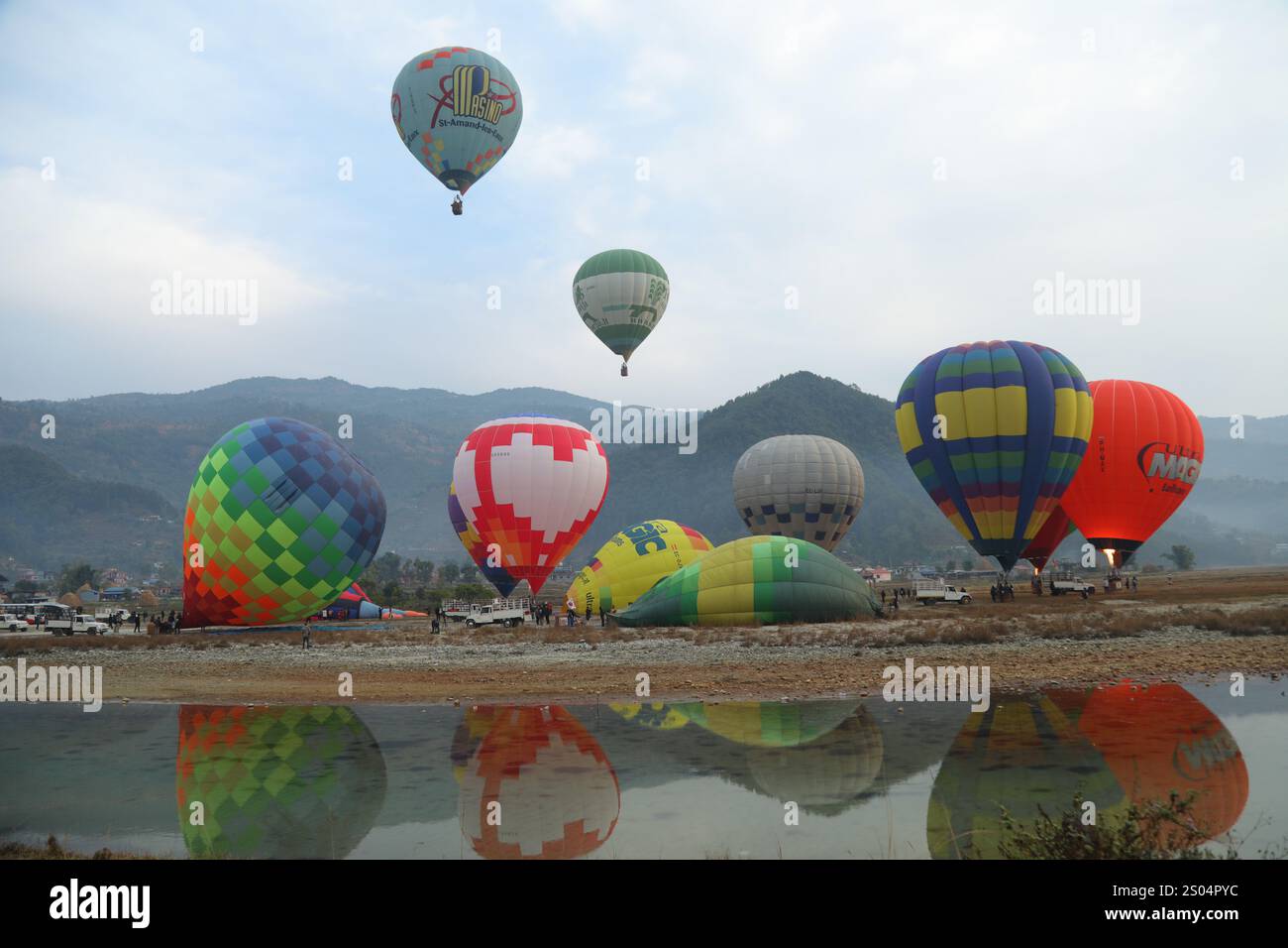 Pokhara, Nepal. 24th Dec, 2024. Hot air balloons rise in the sky of ...