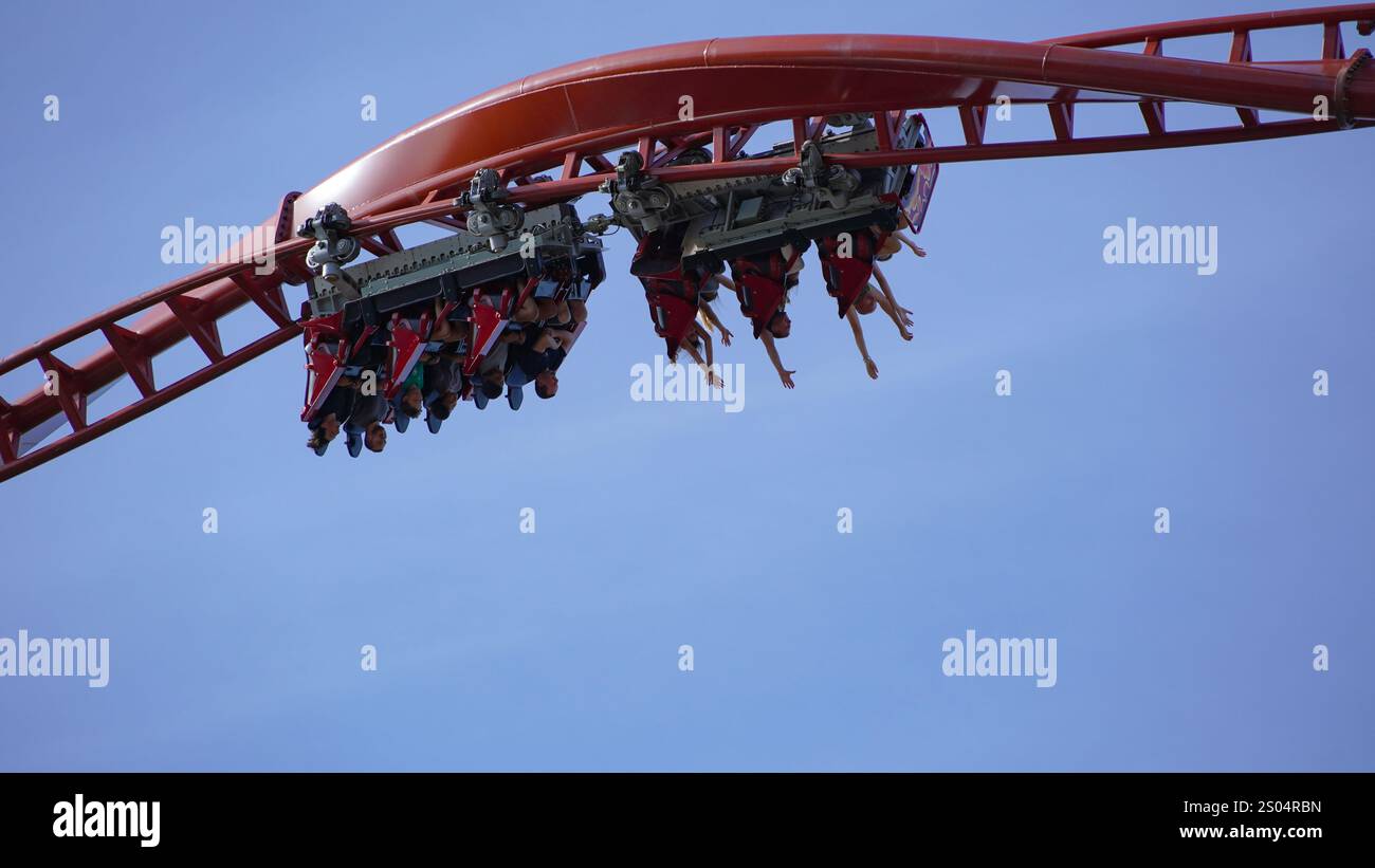 Young people have fun on the overhead element on the extreme catapult ...