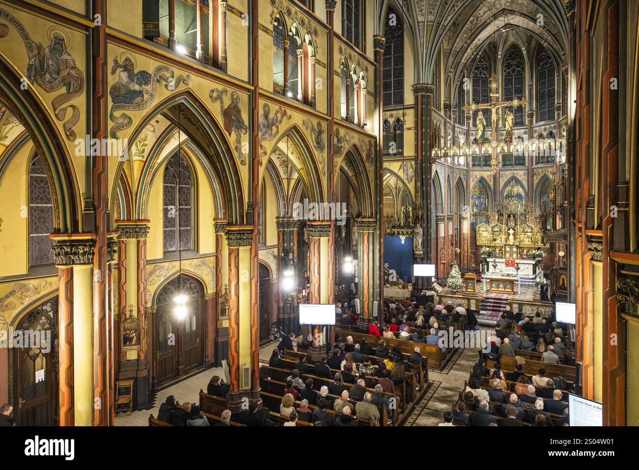 AMSTERDAM - Churchgoers during a moment of reflection during Midnight ...