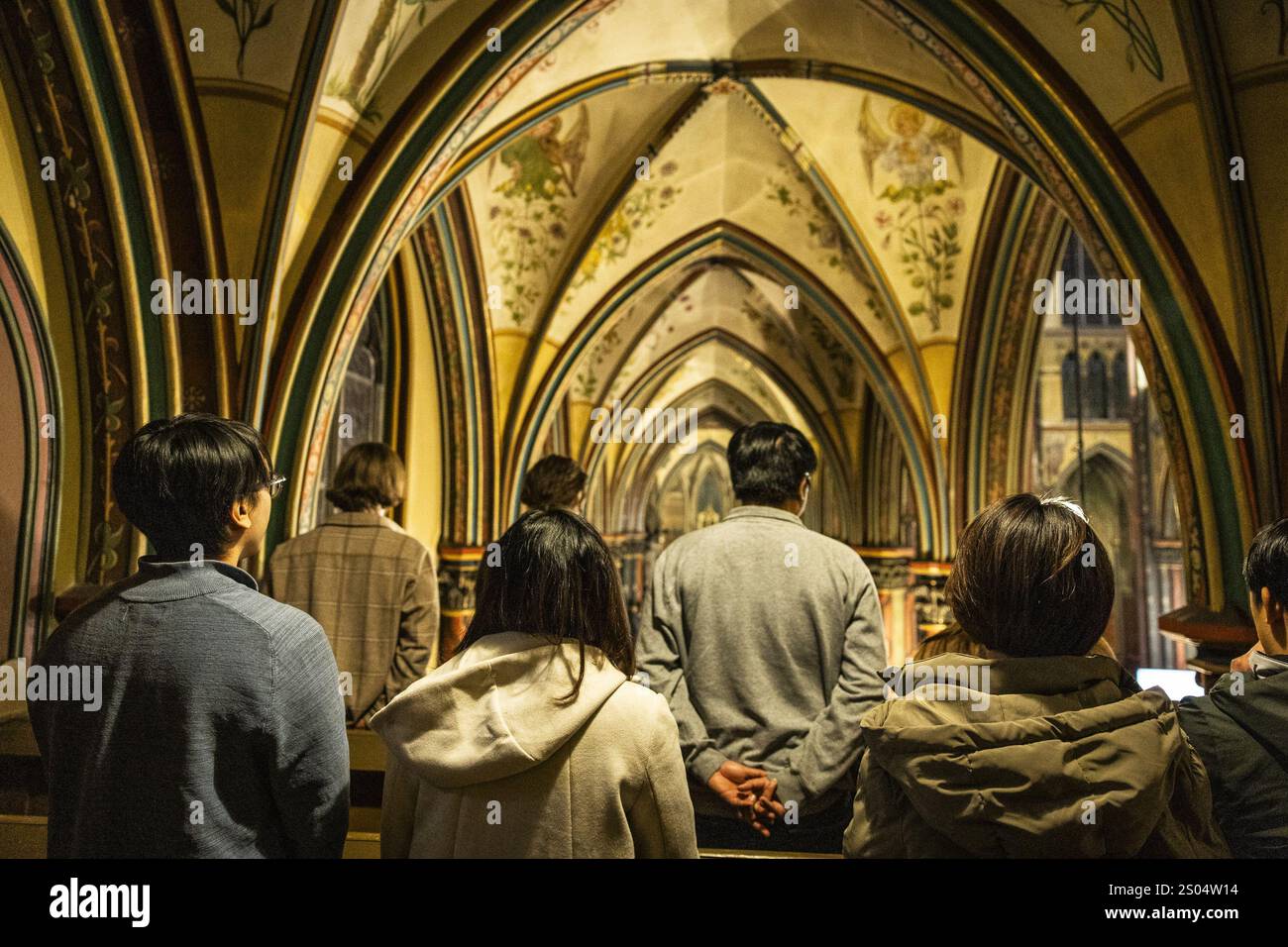 AMSTERDAM - Churchgoers during a moment of reflection during Midnight ...