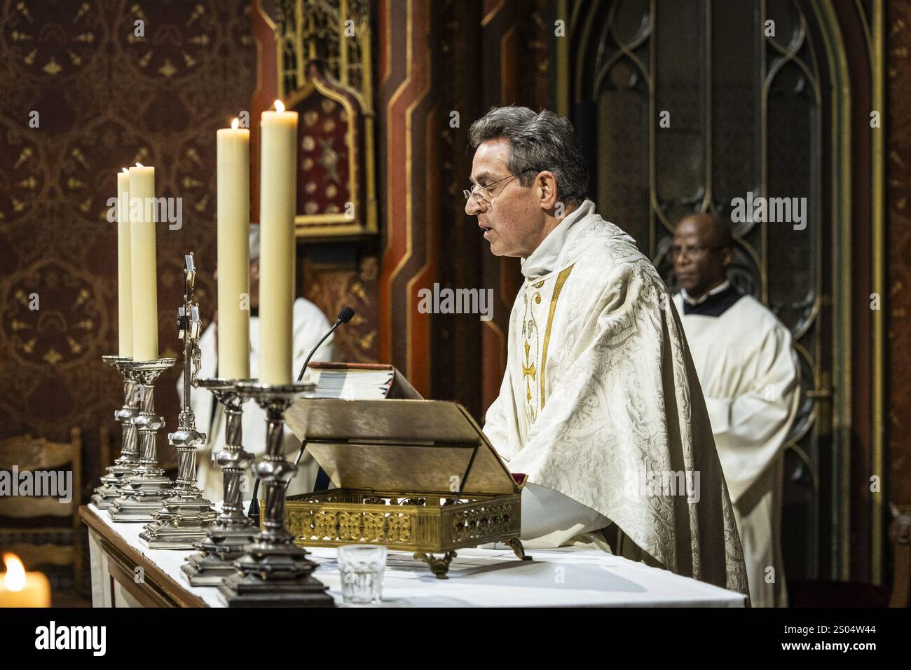 AMSTERDAM - Pastors during a moment of reflection during Midnight Mass ...