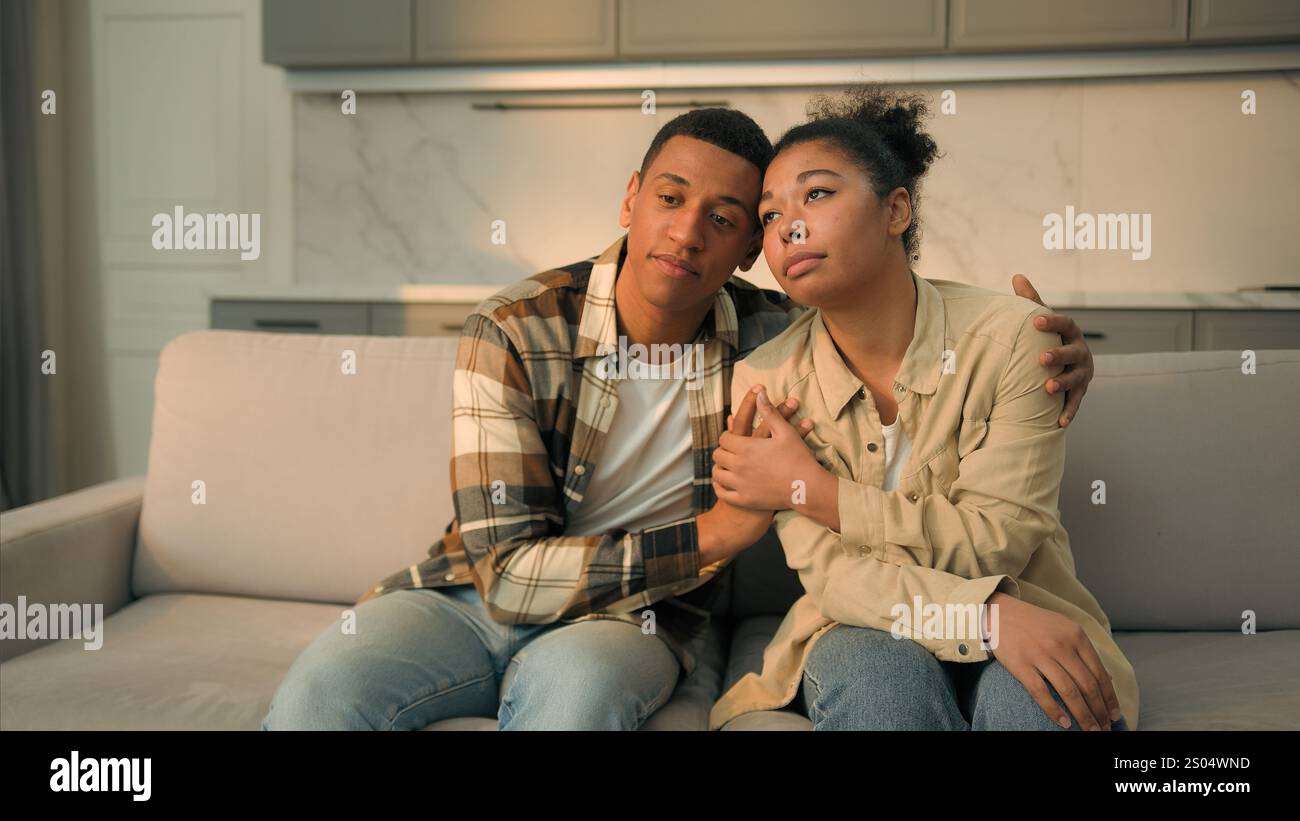 Upset African American married couple sad family renters home owners ...