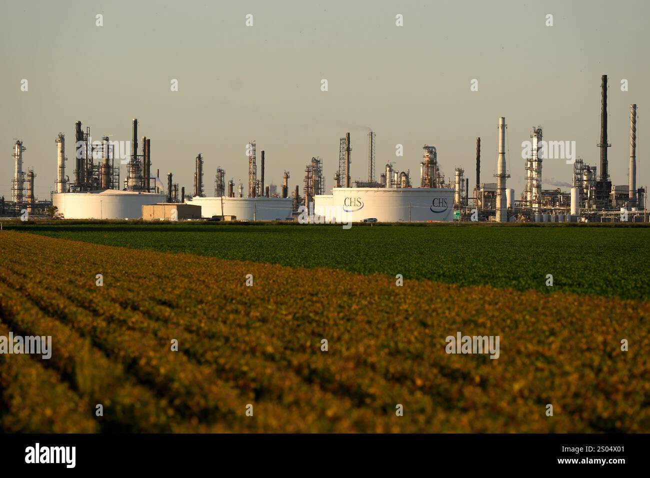 A motorist drives past the CHS oil refinery Saturday, Sept. 28, 2024 ...