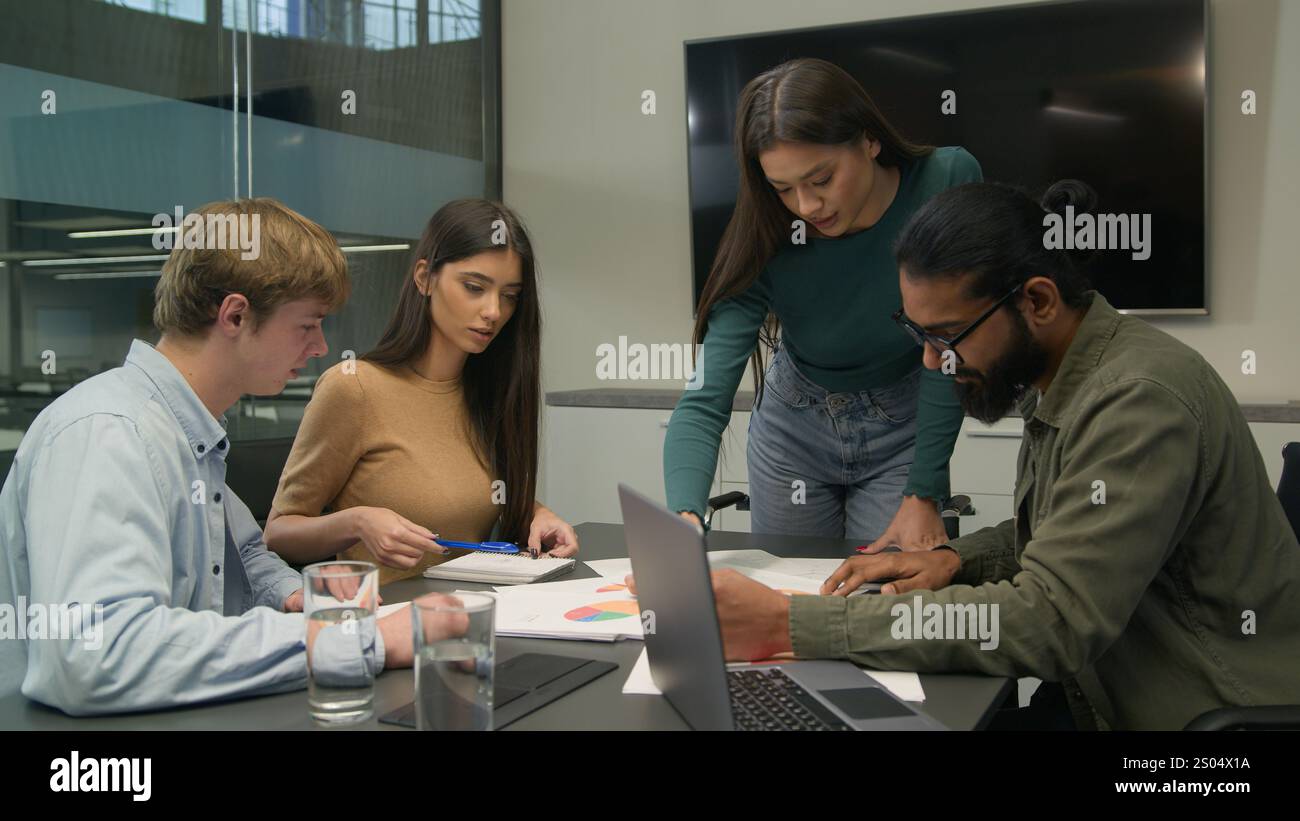 Multiracial businessmen businesswomen colleagues sit at conference ...