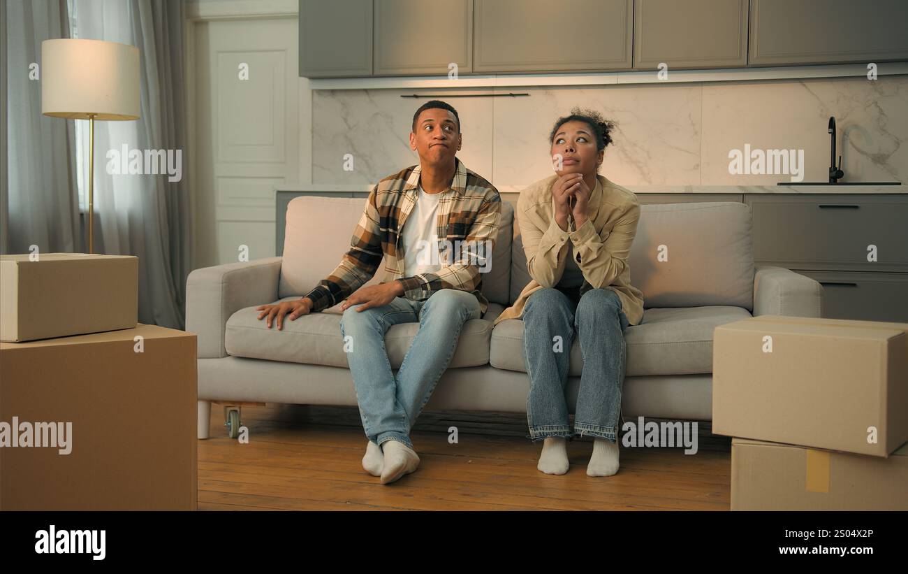 Upset African American married couple sad family renters home owners ...