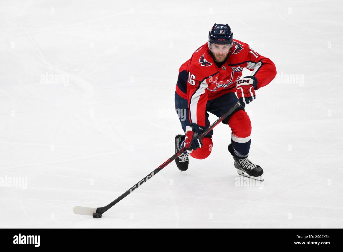 Washington Capitals right wing Taylor Raddysh (16) skates with the puck ...