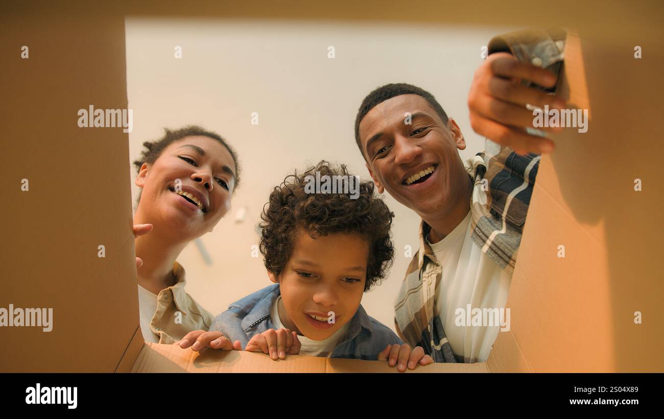 Point of view POV open box African american family parents son ...