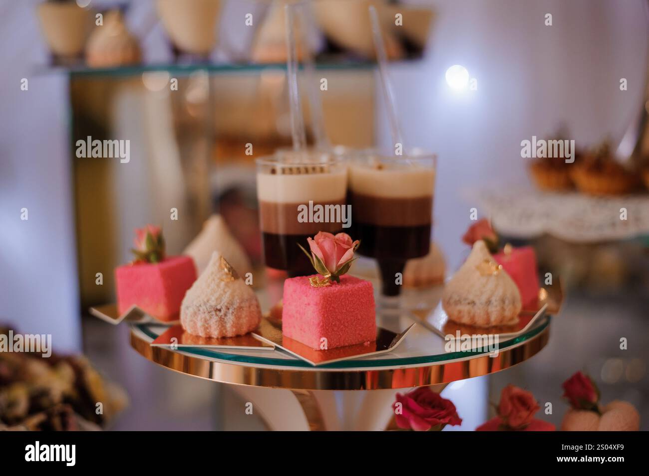 Elegant Dessert Display with Pink Cakes and Chocolate Mousse Stock ...