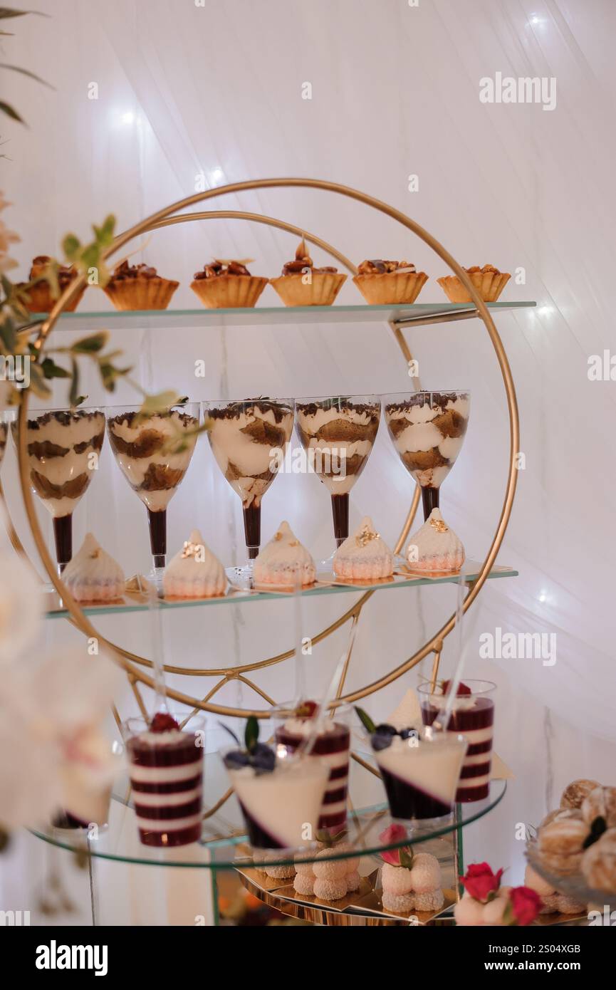 Elegant Dessert Display Featuring Layered Cups and Tarts Stock Photo ...