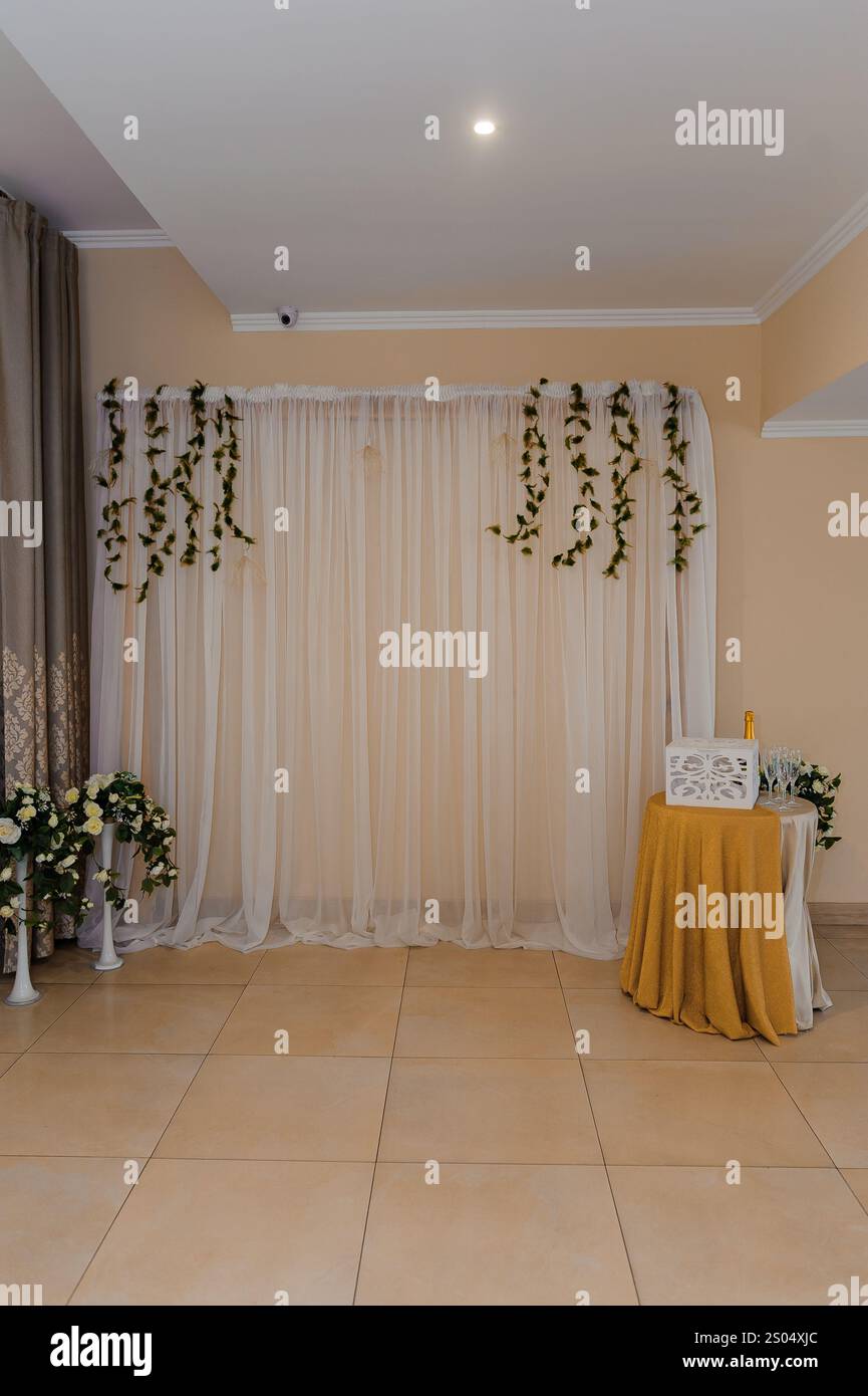 Elegant Event Backdrop with Drapery and Floral Accents Stock Photo - Alamy