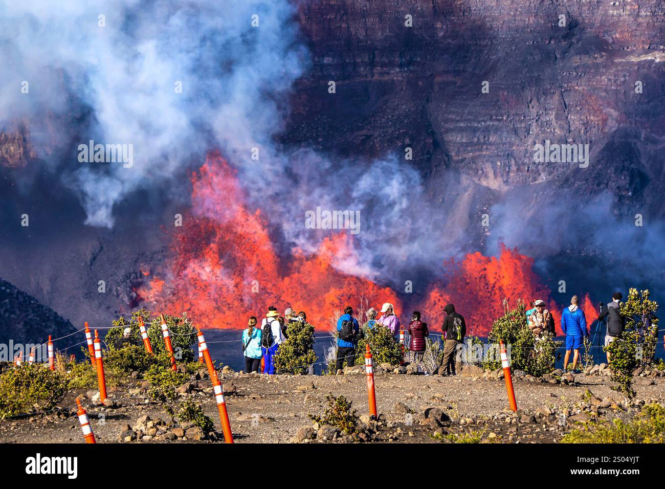 In this photo provided by the National Park Service, people watch as an ...