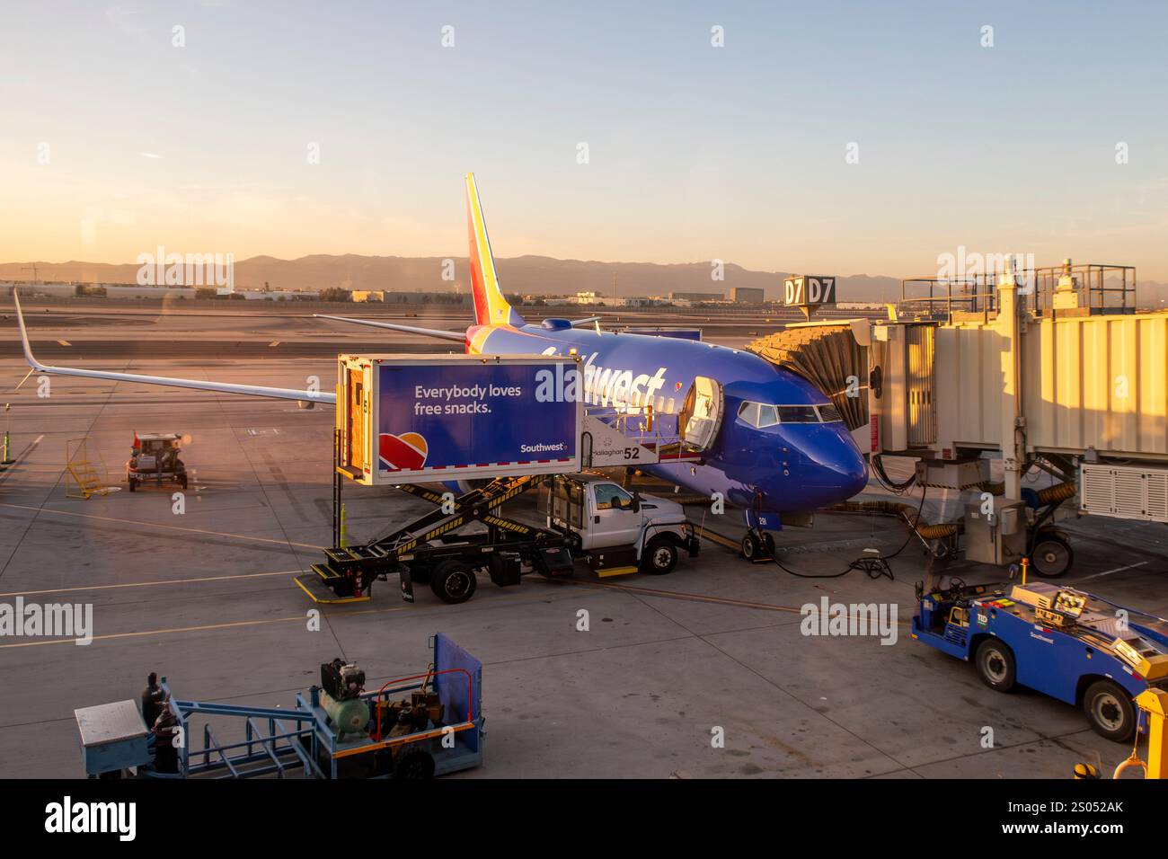 Phoenix, USA. 24th Dec, 2024. A Southwest Airlines plane is parked at a ...