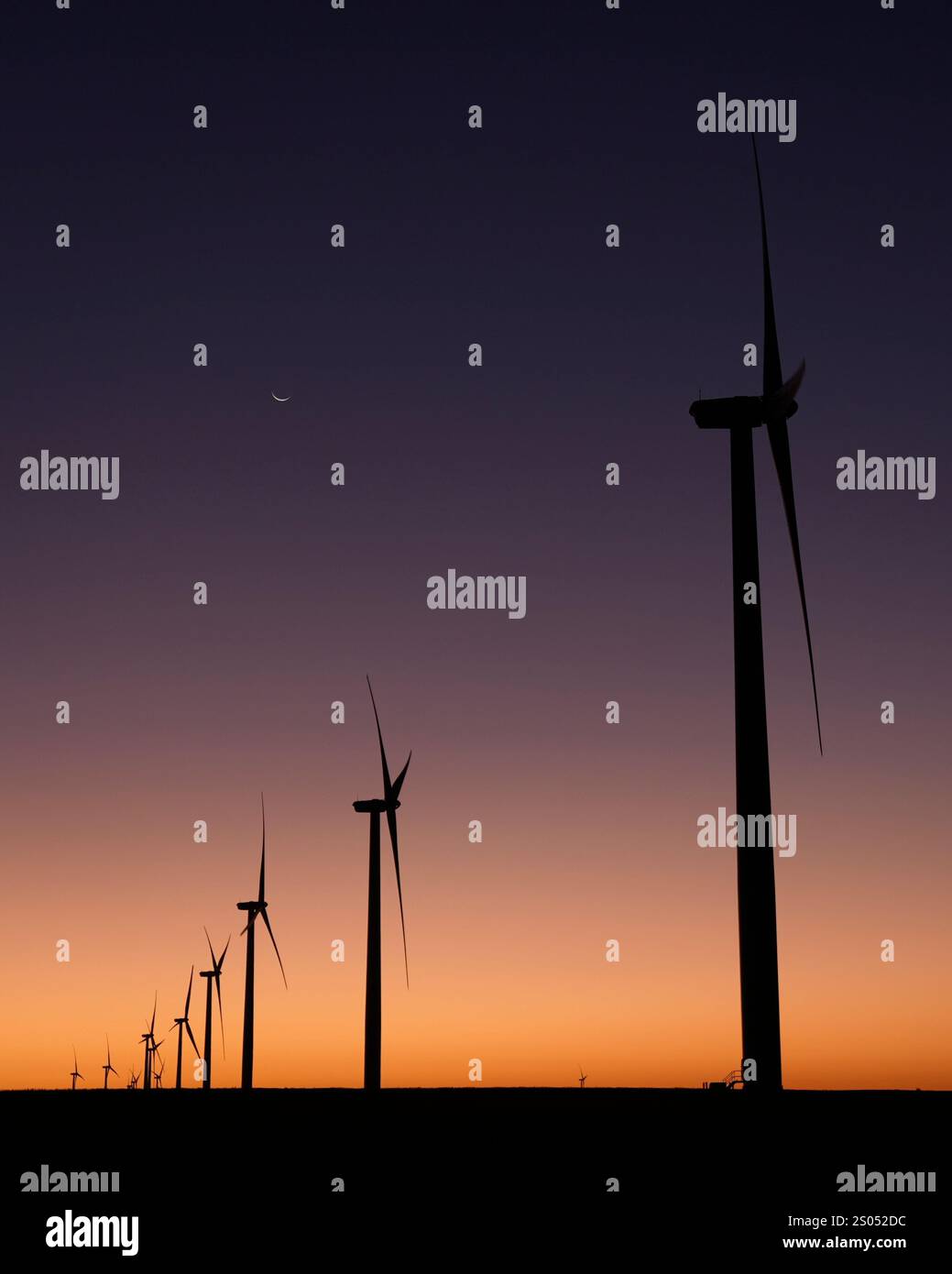 The crescent moon rises behind wind turbines at the Buckeye Wind Energy ...