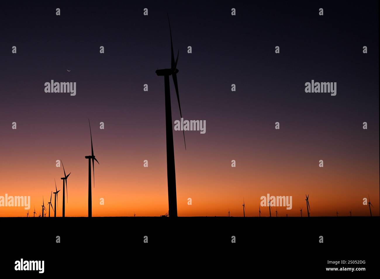 The crescent moon rises behind wind turbines at the Buckeye Wind Energy ...
