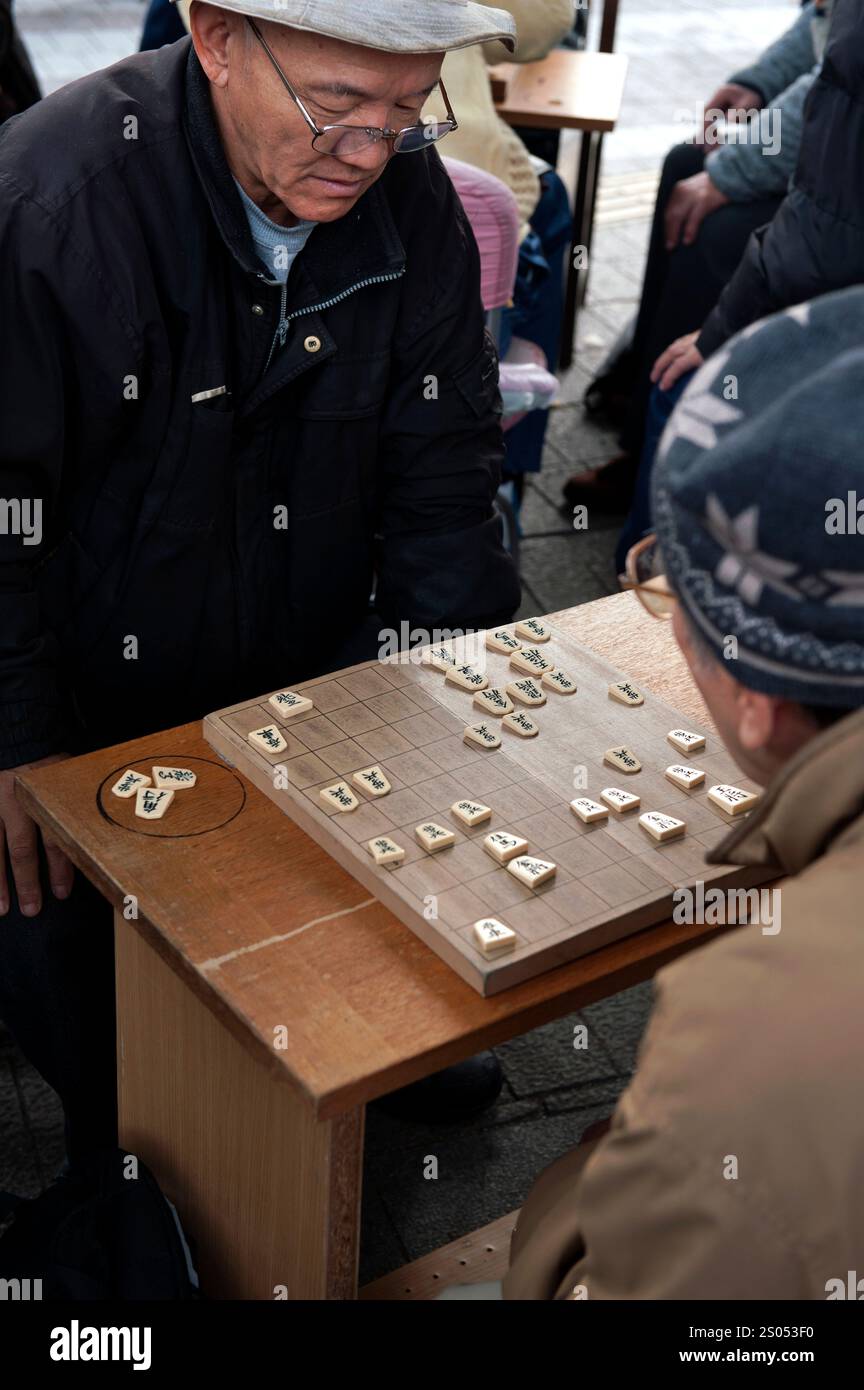 Competitors challenging each other to a strategy board game called ...
