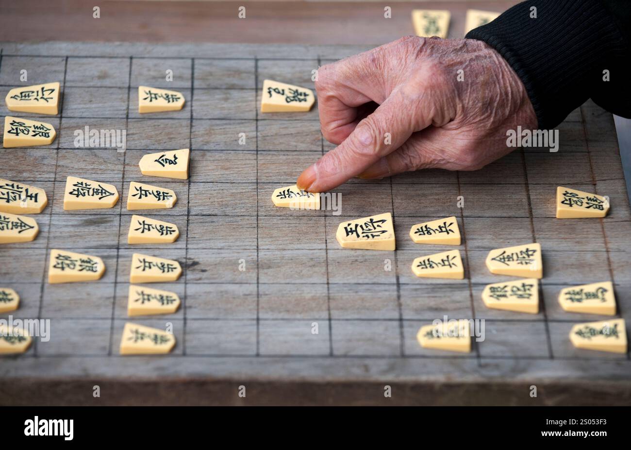 Competitors challenging each other to a strategy board game called ...