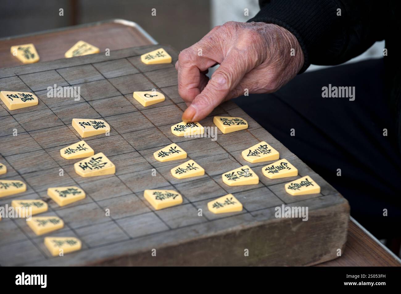 Competitors challenging each other to a strategy board game called ...